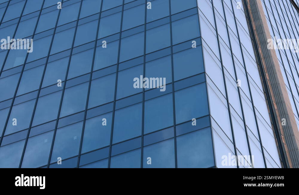 Close-up high rise skyscraper glass facade windows grid in downtown ...