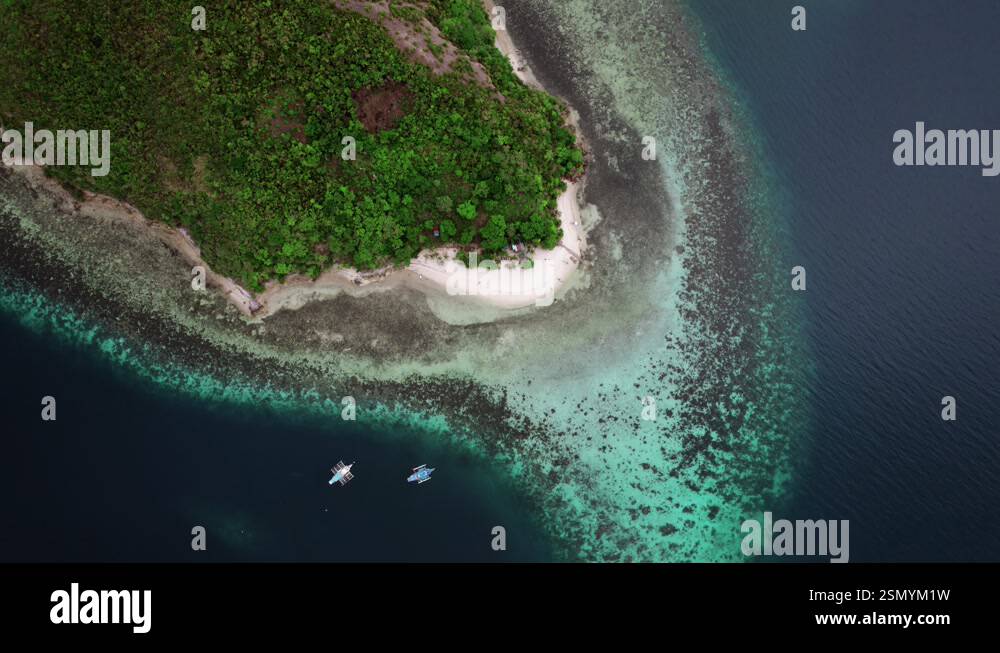 A top-down rotating aerial view of an island in the Philippines ...