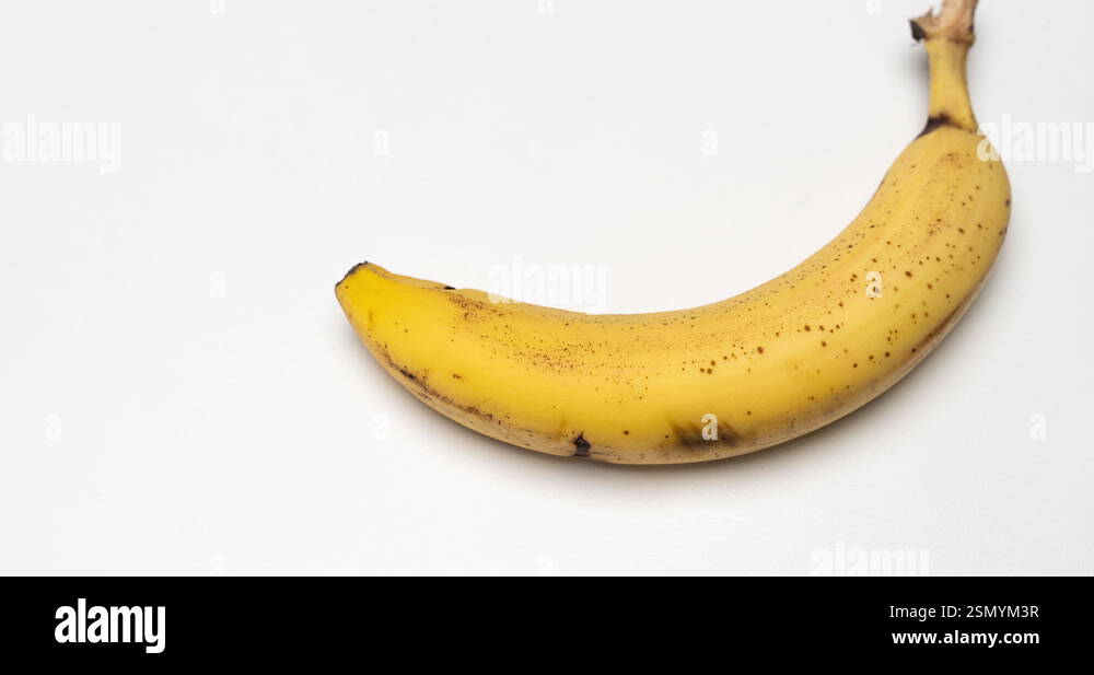 In a stop-motion clip on a white background, a banana moves to the ...