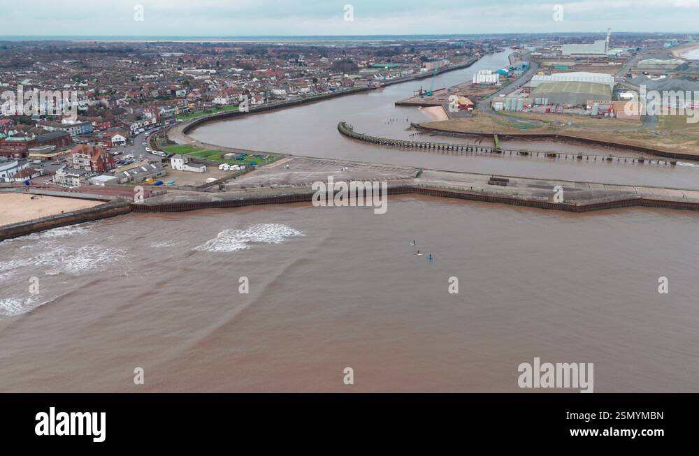 The intriguing confluence where a winding river meets the sea. The ...