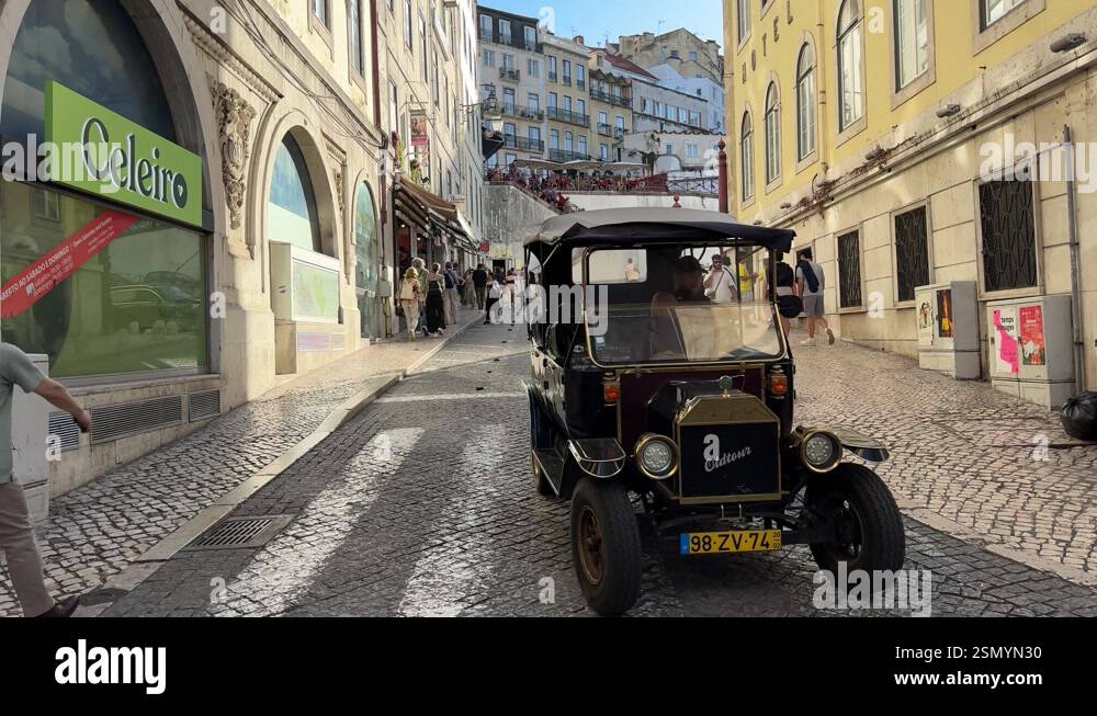 Lisbon, Portugal - 06/20/2024: Vehicles drive toward the camera view ...