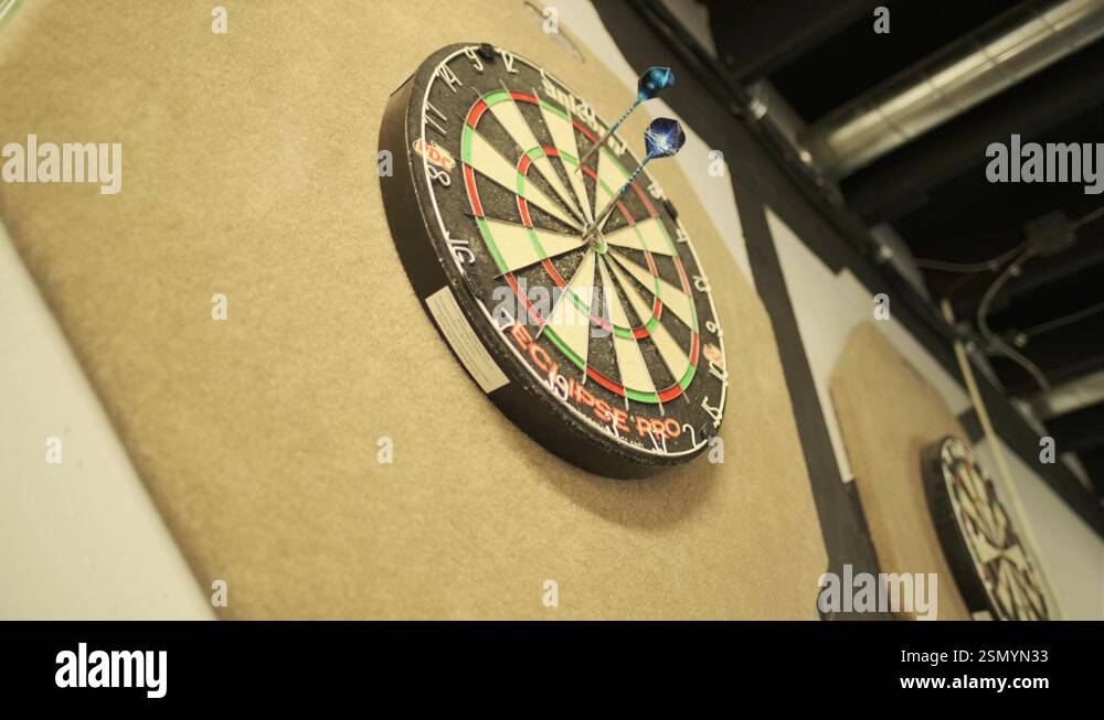 Throwing Darts At A Dartboard - Low Angle Shot Stock Video Footage - Alamy