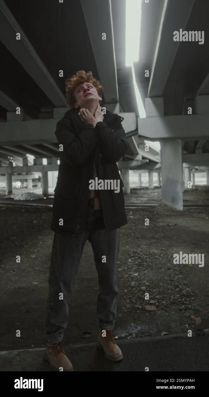 Depressed Young Man Shouting and Nervously Touching Head and Neck Stock ...