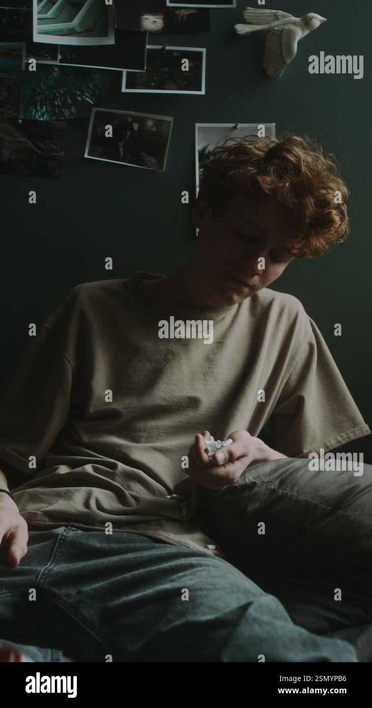 Devastated Young Man Pouring Capsules from Bottle into Open Hand Stock ...