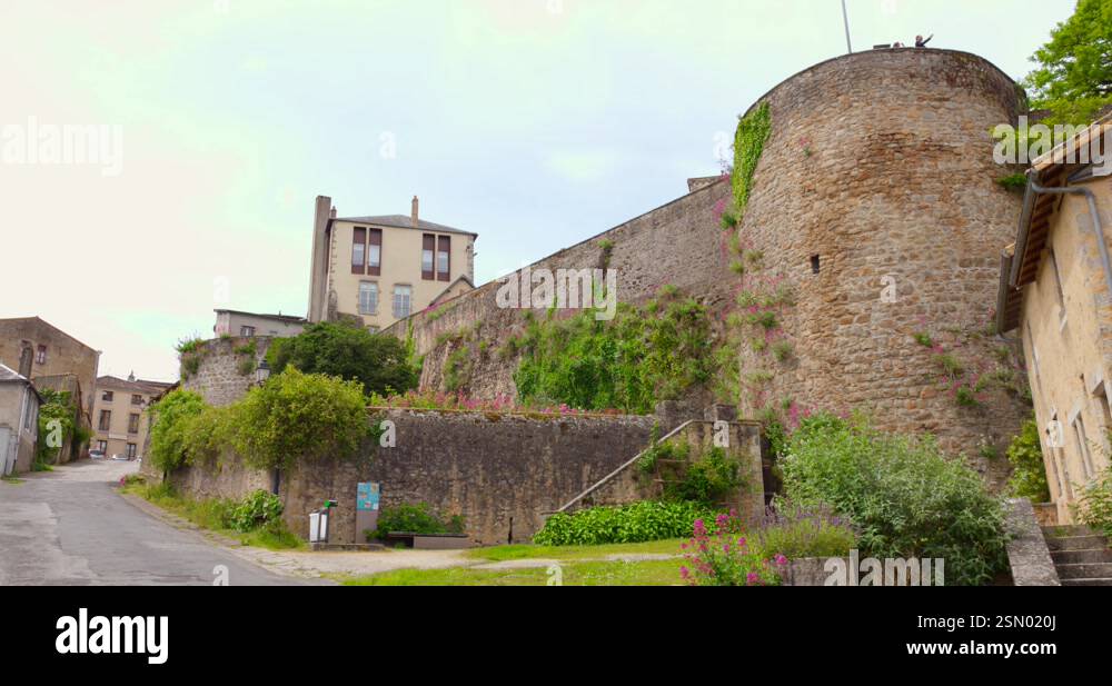 Parthenay, France - 09/03/2024: The walls and tower of the castle in ...