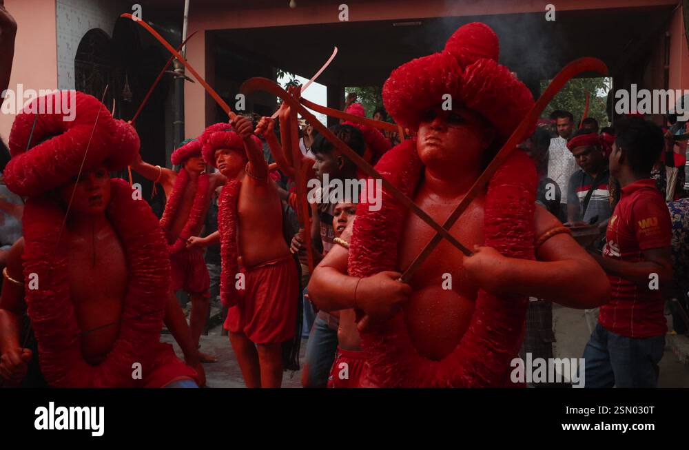 Hindu devotees in orange color Lal Kach festival, Munshiganj Sadar ...