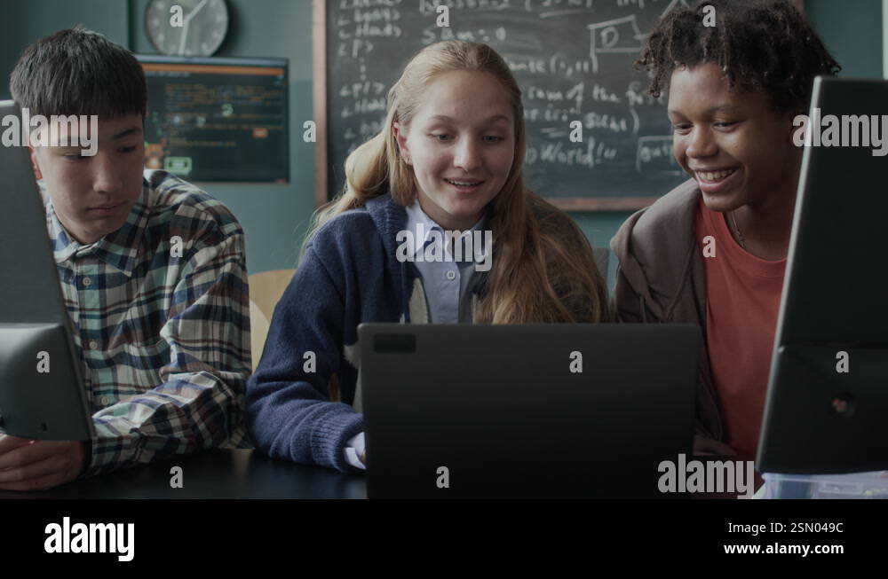 Multiethnic Gen Z Students Chatting during Programming Lesson Stock ...