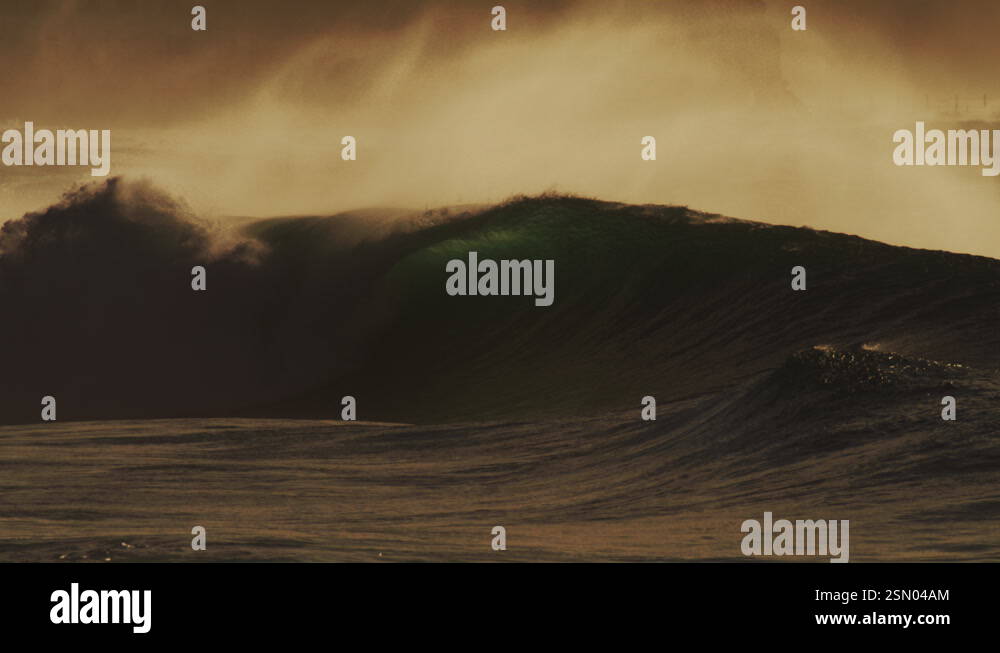 Slow-motion wave crashing with intense force at golden hour in Sydney ...