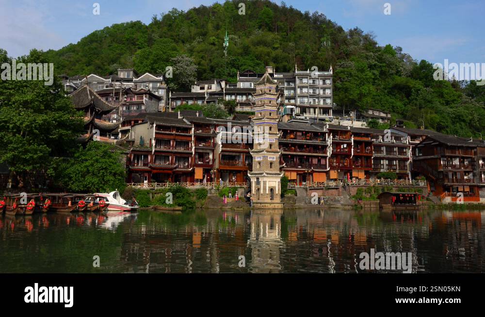 Wanming Pagoda and traditional Chinese buildings along Tuojiang River ...