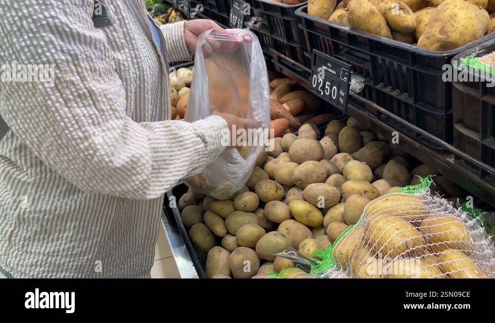 Female buying a potato from store. Doha, Qatar 14-09-2024 Stock Video ...