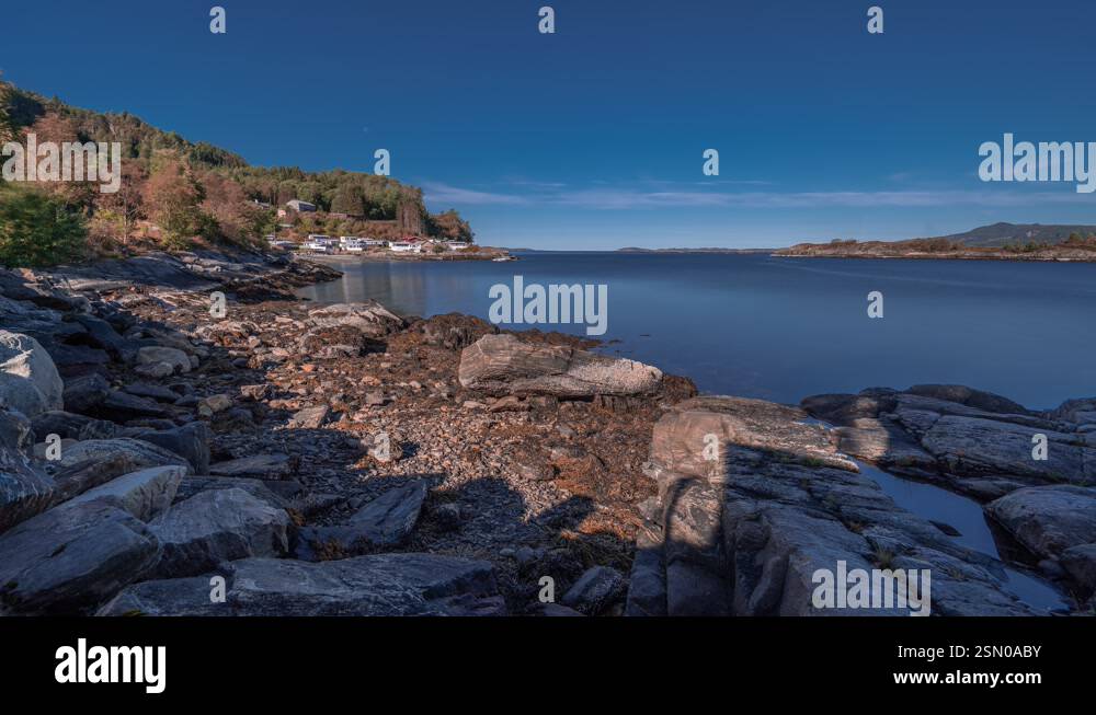 A timelapse video shows the rocky bottom of the fjord, covered with ...