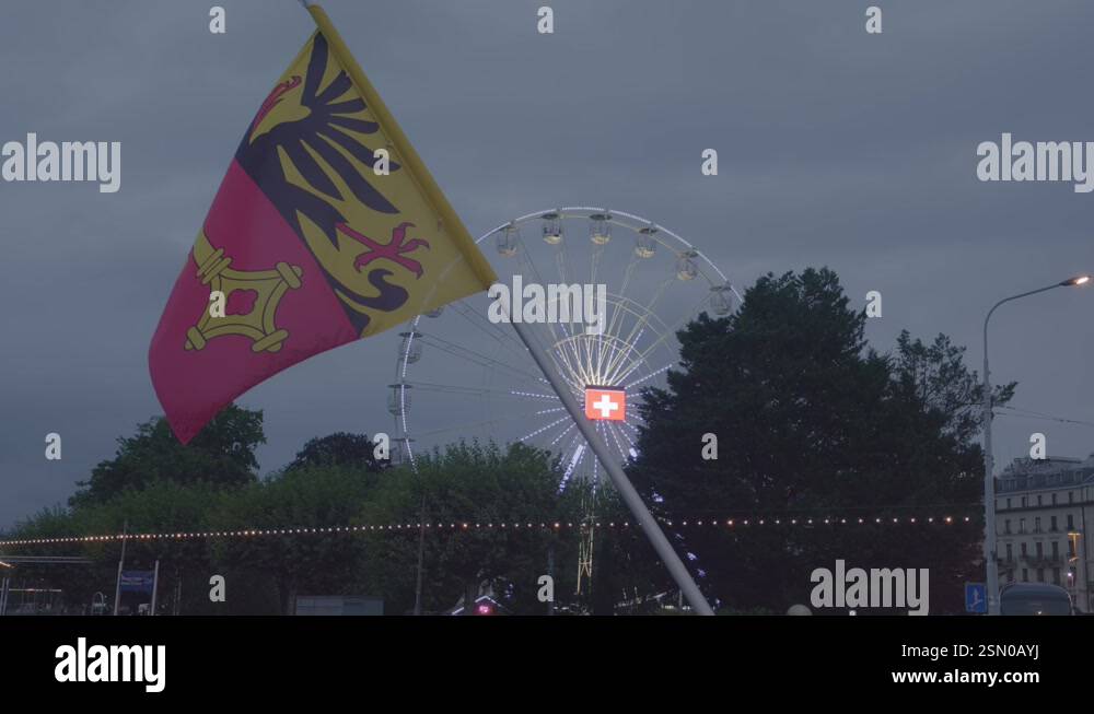 Static view of the Wonder Wheel of Geneva with a flag of Geneva waving ...