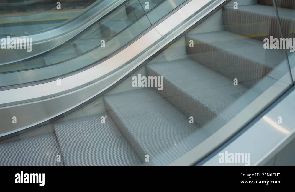 Modern escalator with glass railings in a public space Stock Video ...