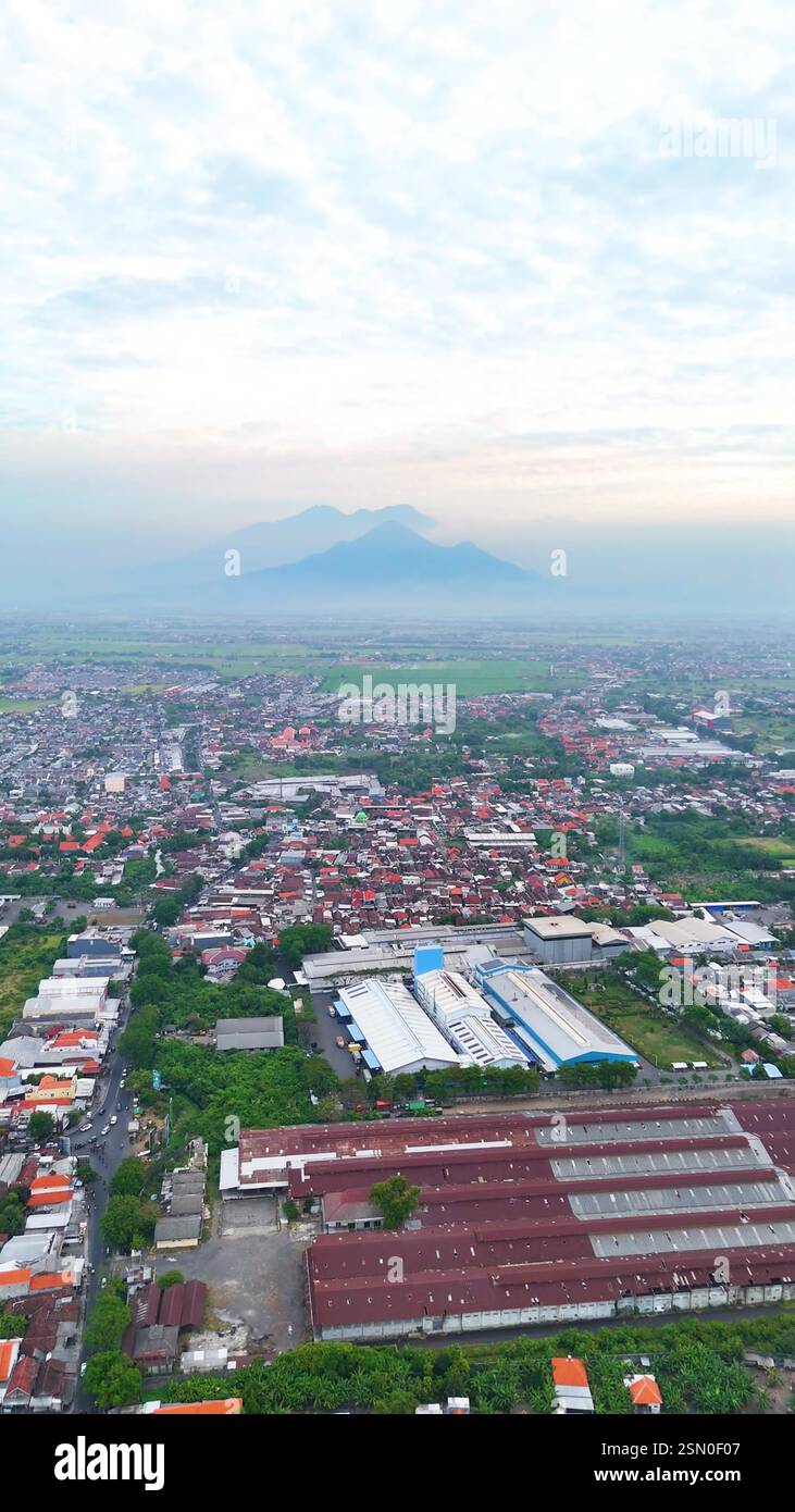 Vertical aerial view of Sidoarjo city with the stunning backdrop of ...