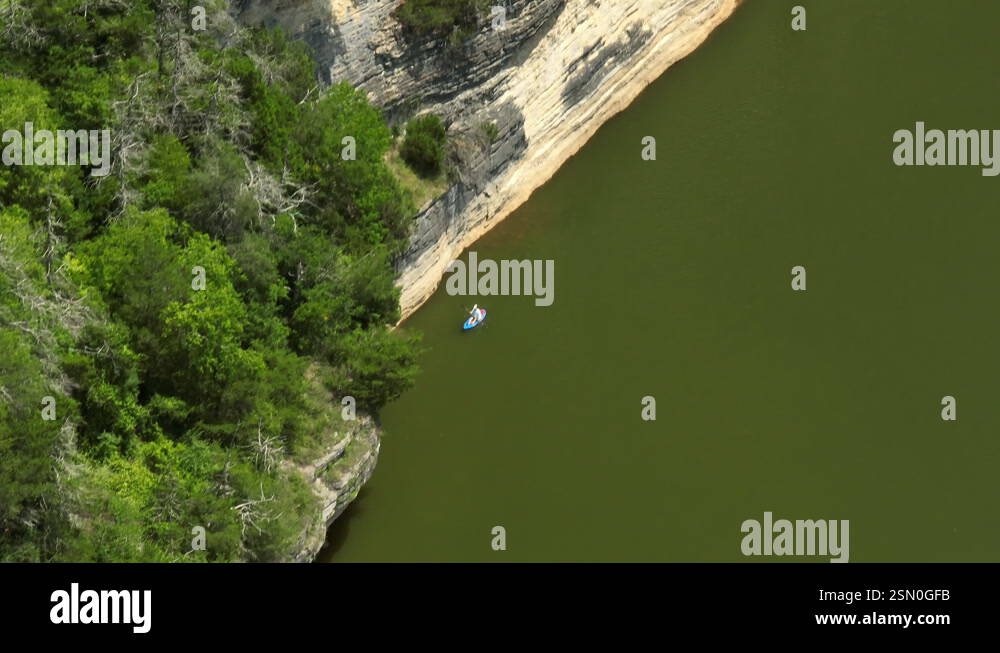 Canoe Boat On The Beaver Lake With Towering Limestone Bluffs In The ...