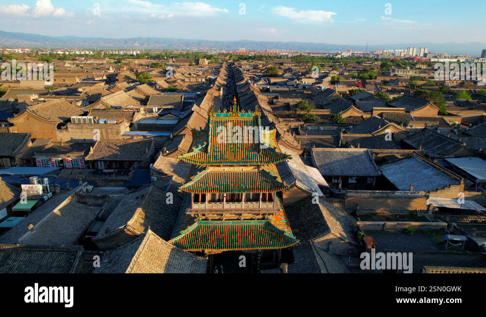 Sunset over Chinese ancient town of Pingyao. Pagoda aerial reveal Stock ...