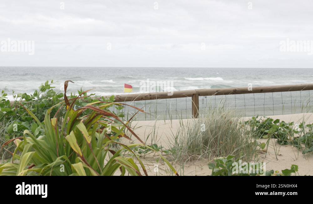 Red and yellow flags area patrolled by lifeguards Gold Coast, Australia ...