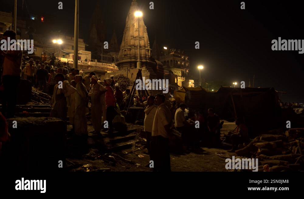 Varanasi, India - 09/11/2024: Crowd of people at Hindu cremation ground ...
