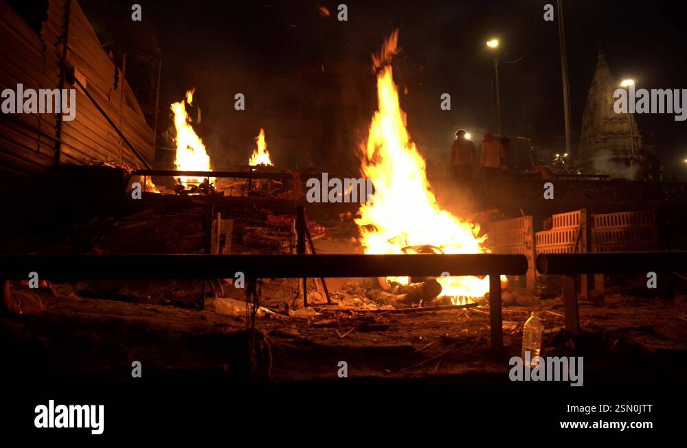 Hindu cremation ground at Manikarnika Ghat on the banks of holy River ...