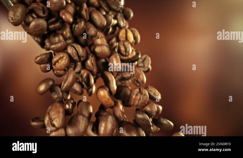 Super Slow Motion of Pouring Coffee Beans from Spoon Stock Video ...