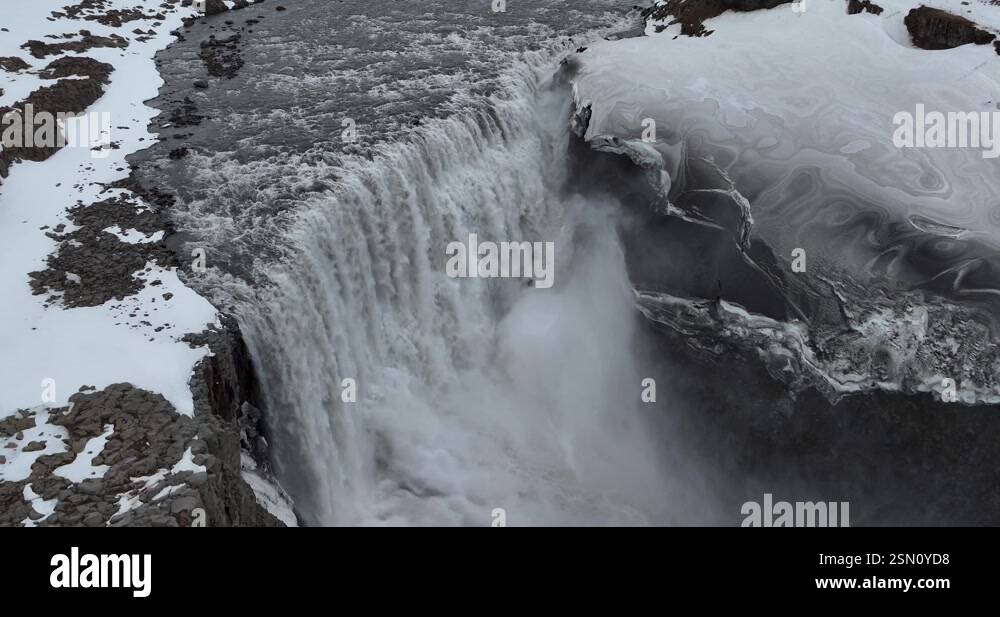 Highlight the natural beauty and majesty of the waterfall, fog, and ...
