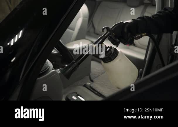 Car detailing with tornador cleaning gun with high pressure air pulse 4k video. Cleaner is ...