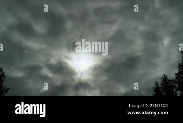 Timelapse of overcast sky with partially translucent grey clouds ...