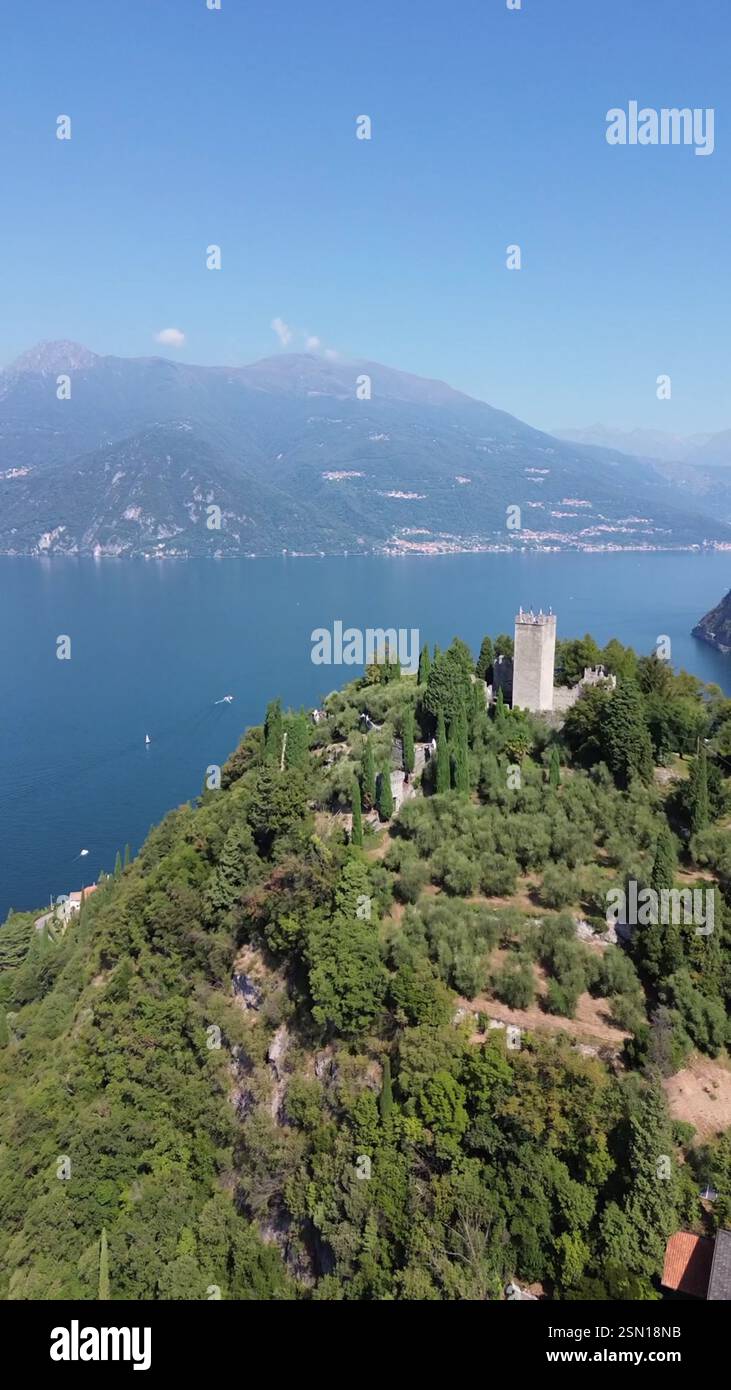 Aerial view of castle by lake and mountains, Italy Stock Video Footage ...