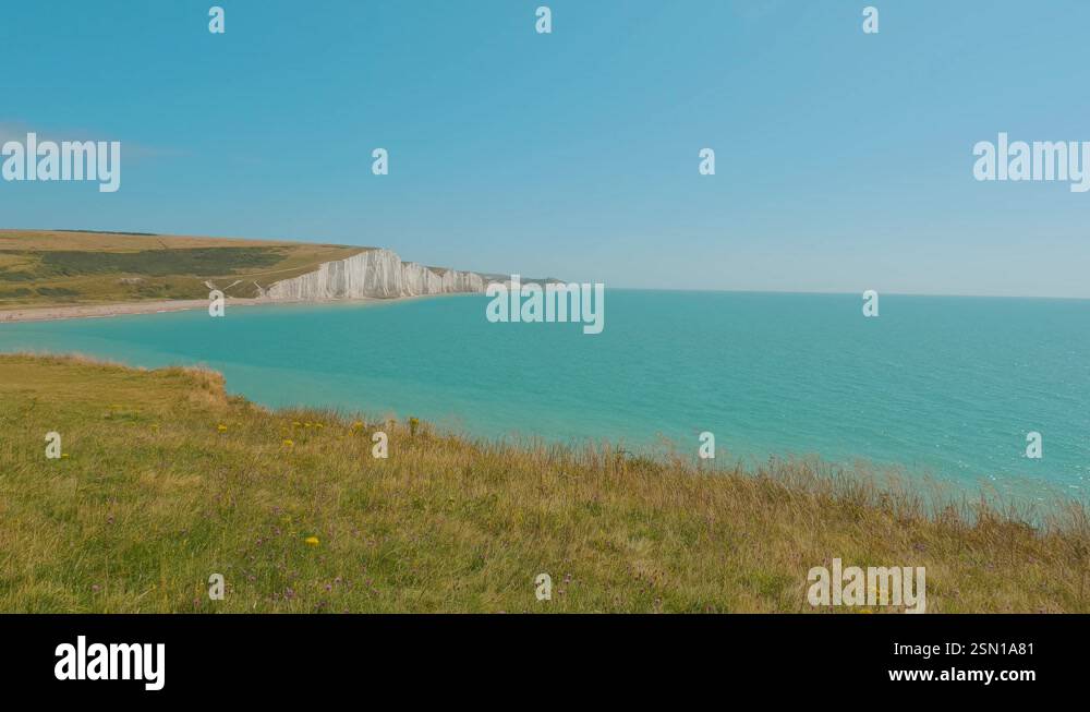 A serene coastal scene with the famous Seven Sisters Cliffs overlooking ...