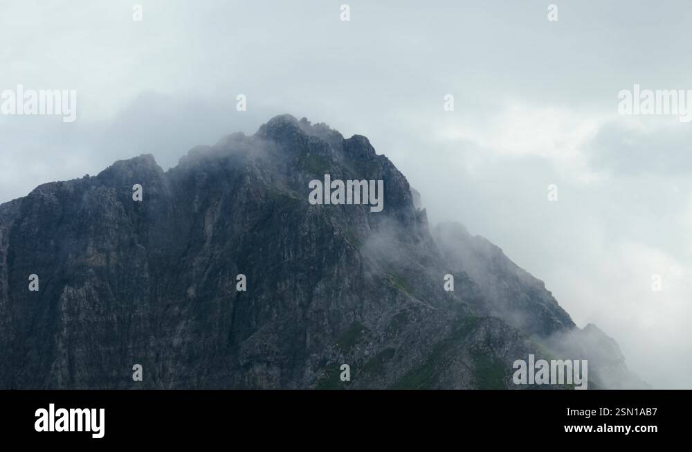 Lombardy, Italy - A Mesmerizing Sight of Grignetta Peak, Veiled in a ...