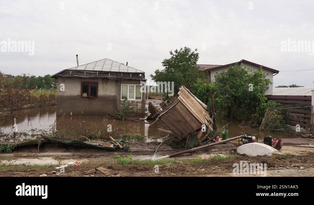 Houses destroyed by floods and pump drains water, Storm Boris in Galati ...