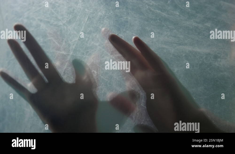 Blurry Hands Moving over Polyethylene Film and Interlacing Fingers ...