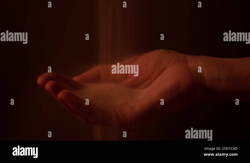 Sand Falling into Hand of Woman and Slipping through Fingers Stock ...