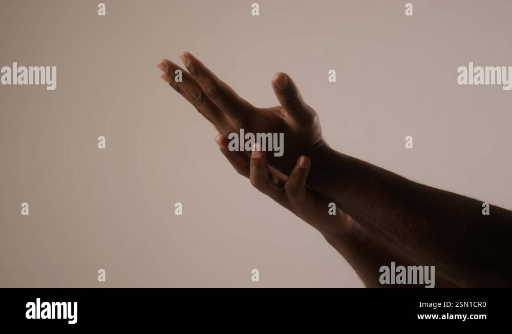 Unrecognisable Man Running Fingers over Back and Inside of His Palm ...