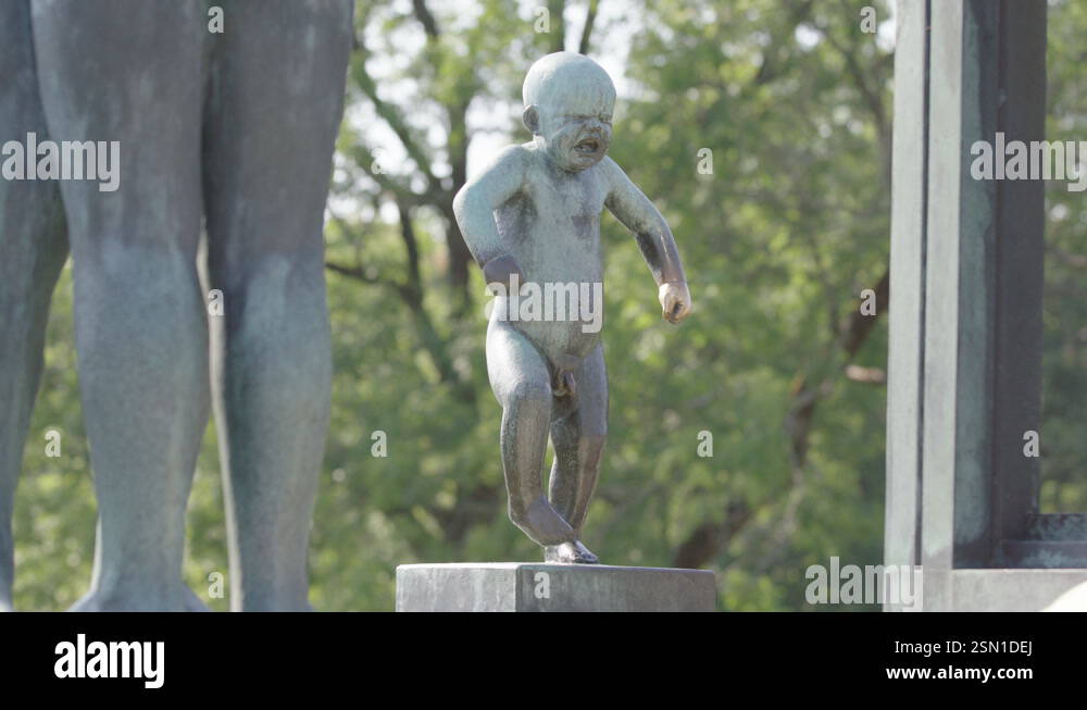 Oslo, Norway - 09/05/2024: A tourist takes a photo of The Angry Boy in ...