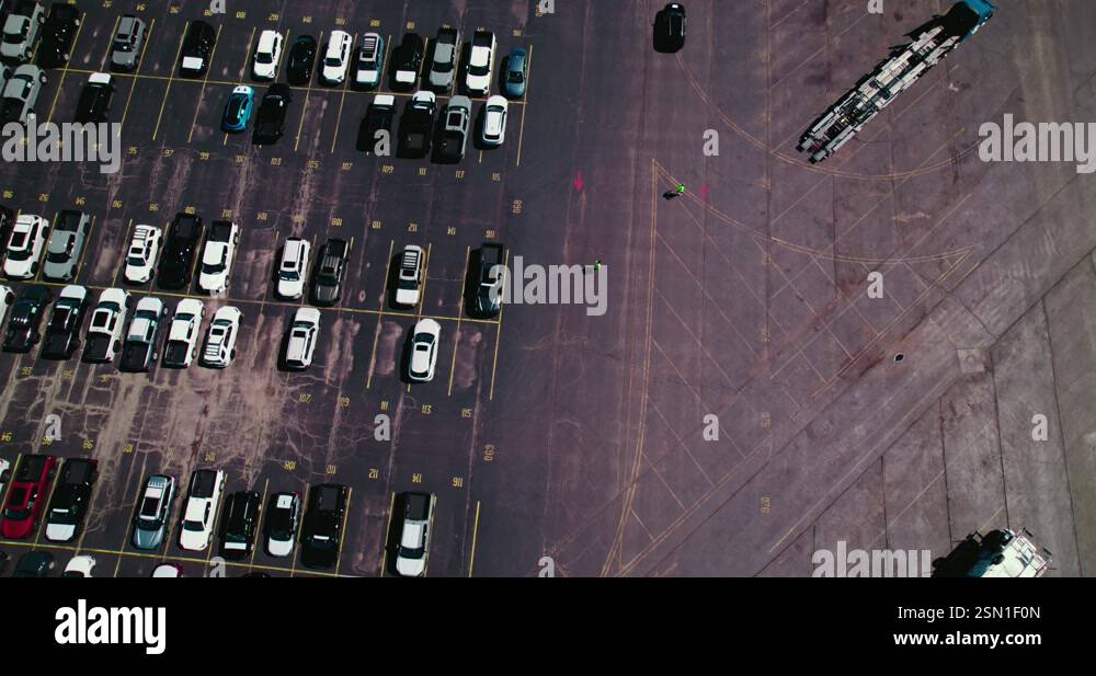 Top shot of Stinger trailer and blue semi truck on auto rail terminal ...
