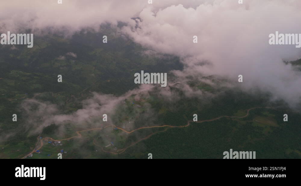 An aerial view of Dolakha, Nepal, showing a green village shrouded in ...