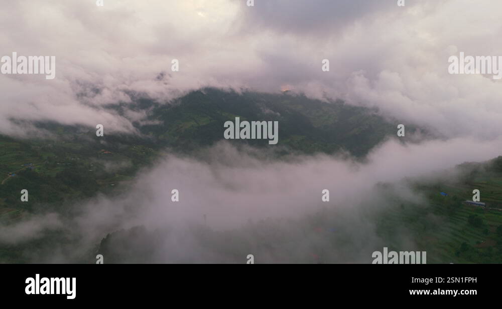 Clouds above Nepali Village in Dolakha landscape captured by drone and ...