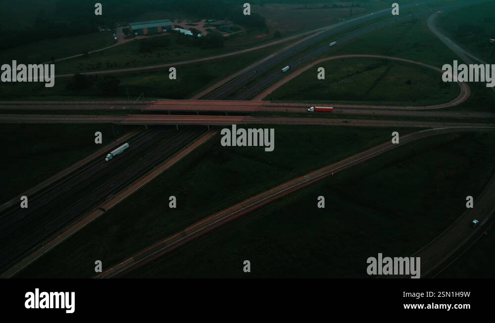 White cab semi truck with orange trailer dry van on bridge. Dark Stock ...
