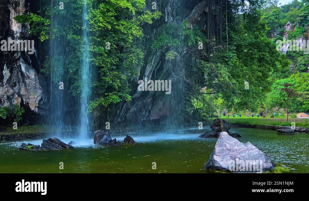 Manmade Waterfall Falling On Lake At Gunung Lang Recreational Park In ...