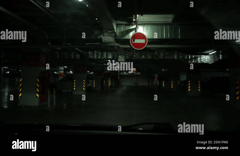 Underground parking lot of shopping mall. View from inside the car ...