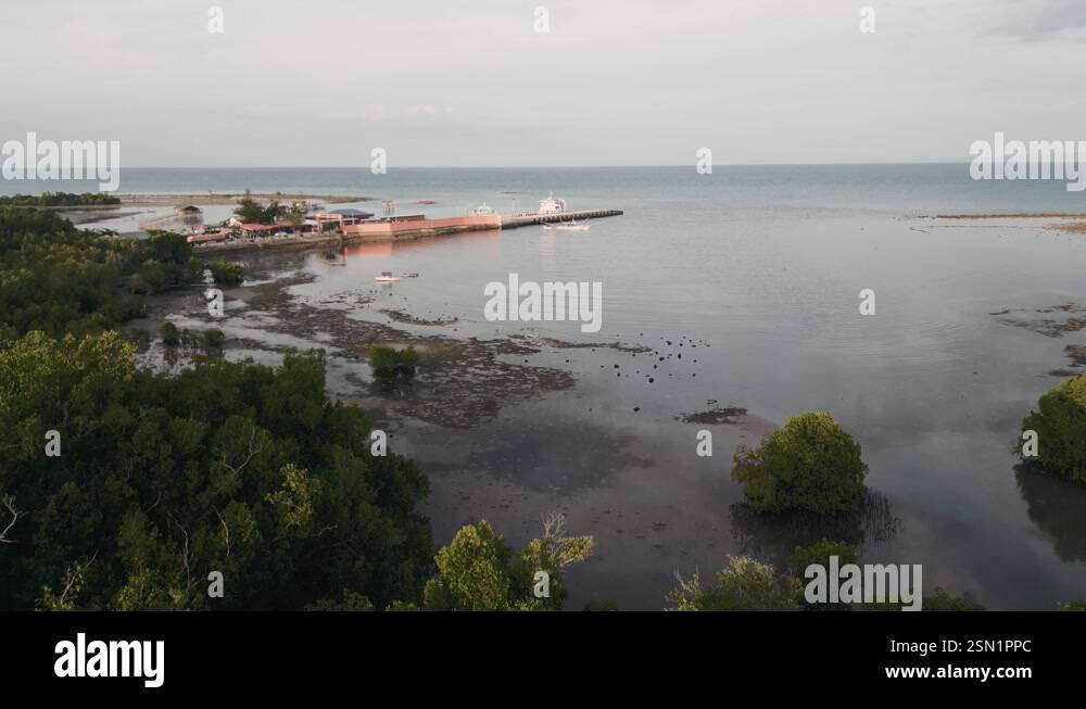 Dramatic aerial overview of Taloot Argao Port at sunrise, showing the Stock Video Footage - Alamy