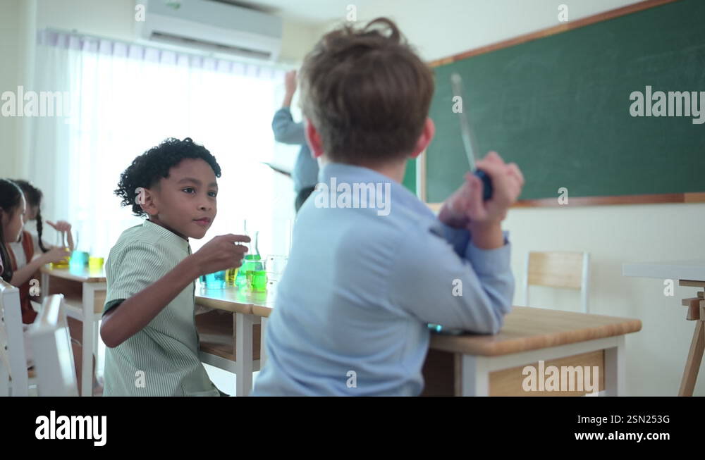 Teacher and students, Learn and experiment with science Stock Video ...