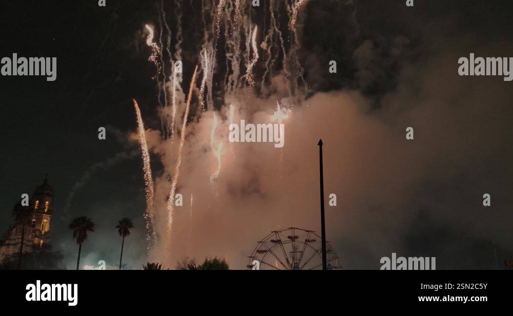 Shot of colorful serpentine fireworks exploding and soaring into the ...