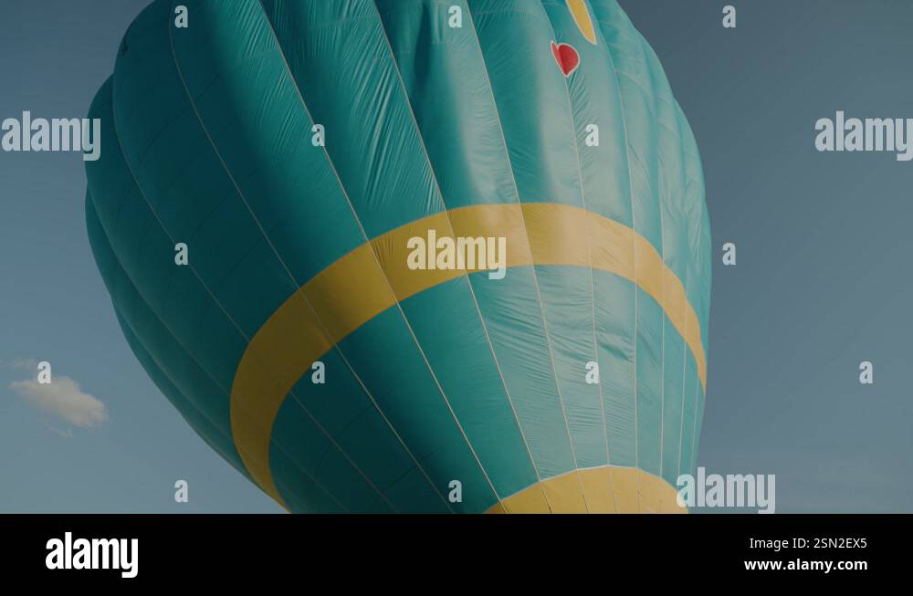 Preparation for flight in a hot air balloon. Large flame of fire heats ...