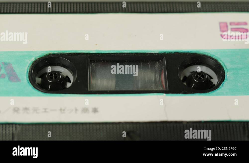 Vintage cassette player with tapes on a desk, creating a nostalgic and ...