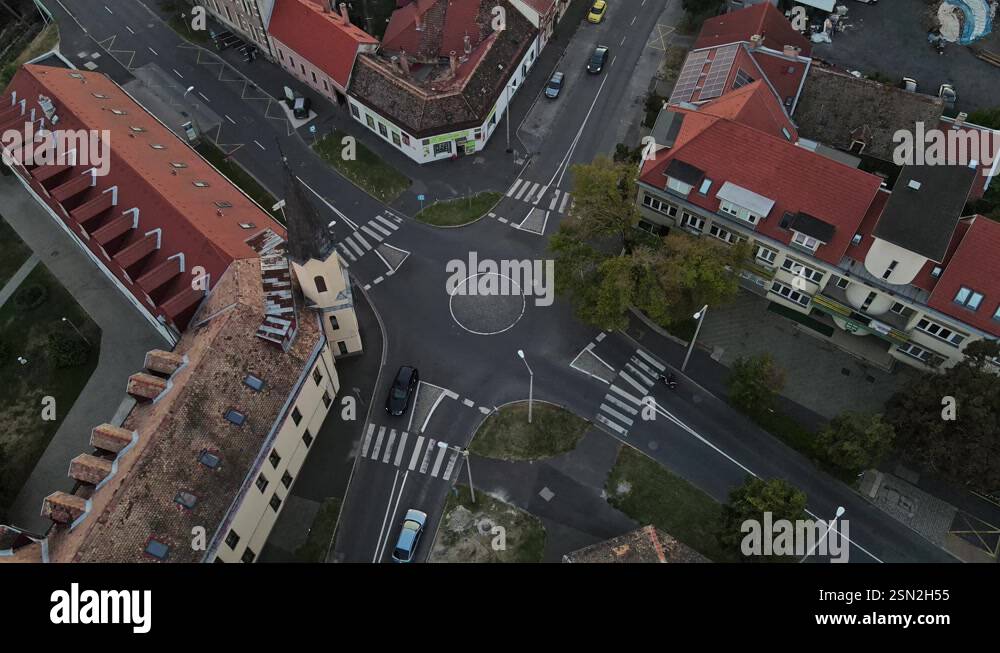 An aerial view of a small town showing a roundabout with cars Stock ...