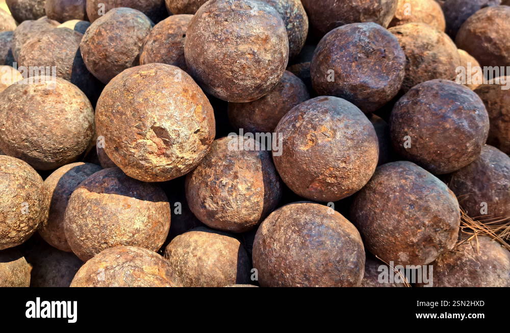 Cannonballs in a pile - pullback reveal of a pile of historic round ...