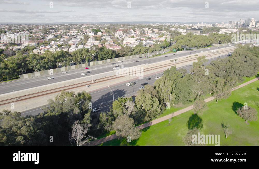 Cars And Trains Running Through The Freeway With Perth Central Business ...