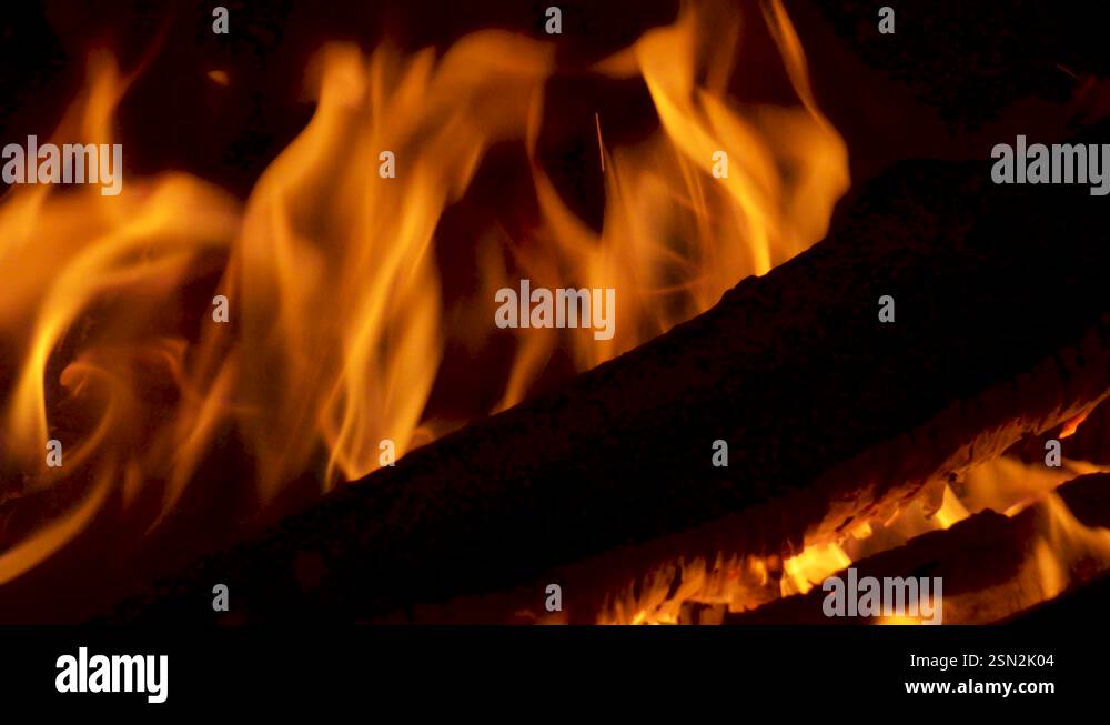 Hot Fire Burning Wooden Logs in Chiminea with Bright Orange Flames in ...